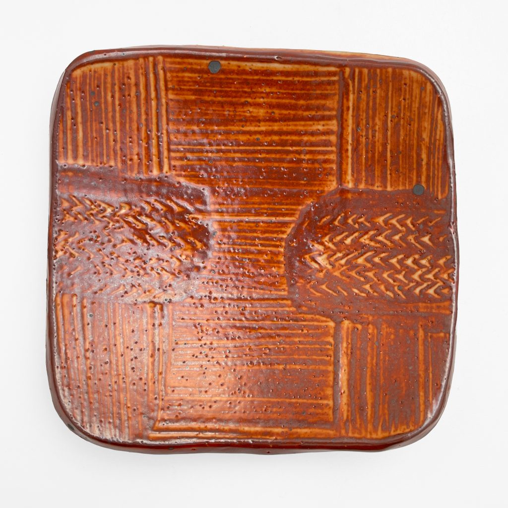 Small Orange/Brown Plate with Line and Chevron Design | Freehand Gallery